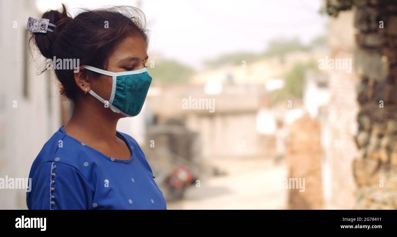 Shallow focus of an Indian girl wearing a face mask- new normal concept Stock Photo - Alamy