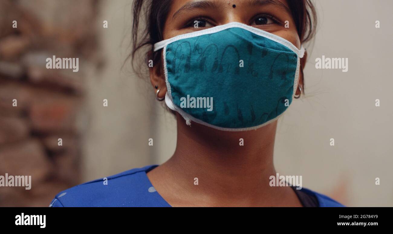 Shallow focus of an Indian girl wearing a face mask- new normal concept Stock Photo - Alamy