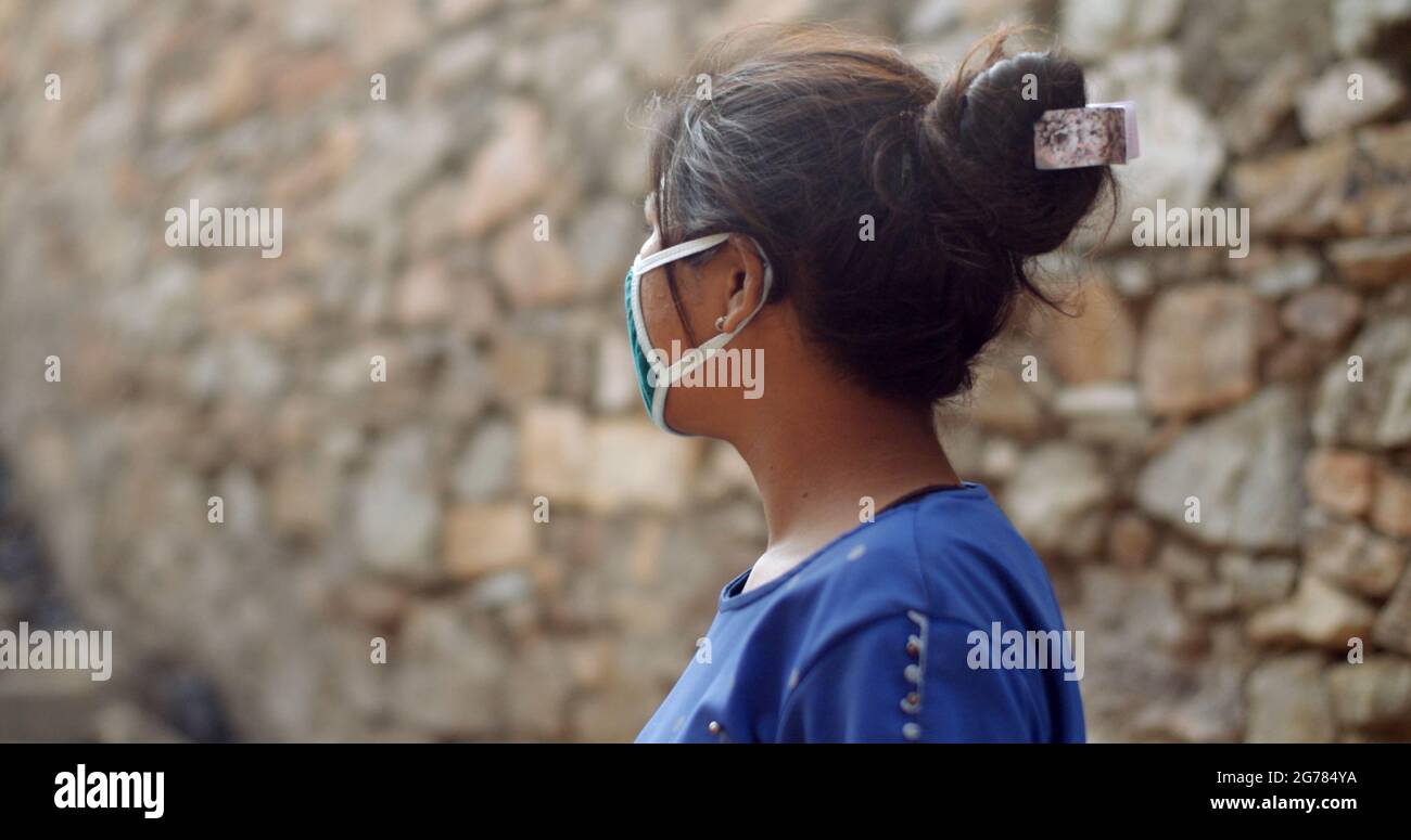 Closeup shot of an Indian girl wearing a mask- new normal concept Stock Photo - Alamy