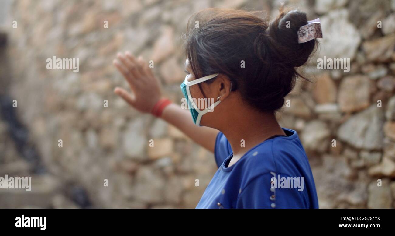 Closeup shot of an Indian girl wearing a mask- new normal concept Stock Photo - Alamy