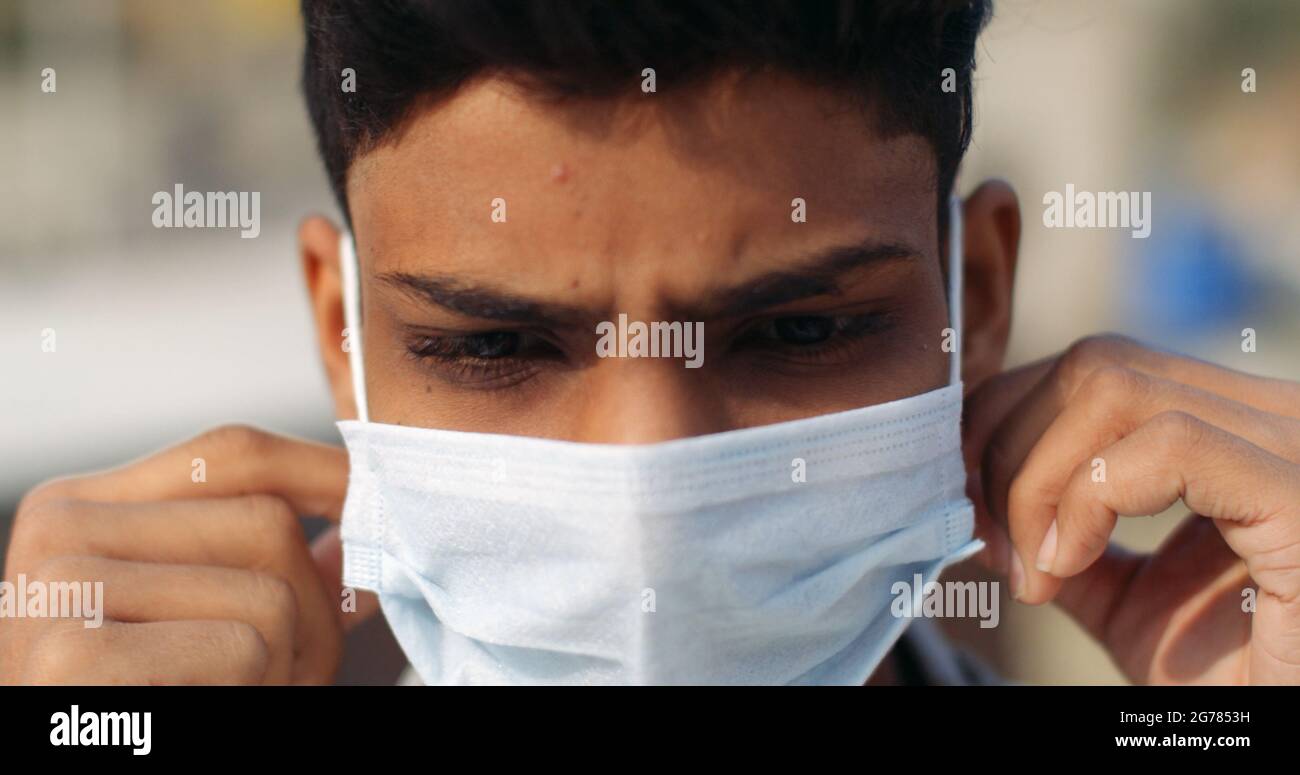 Closeup shot of an Indian boy wearing a mask- new normal concept Stock ...