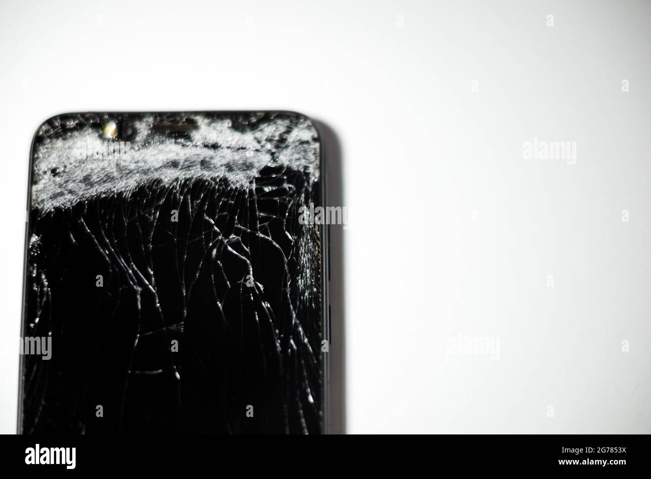 Mobile phone with broken screen on white background.Closeup Stock Photo ...