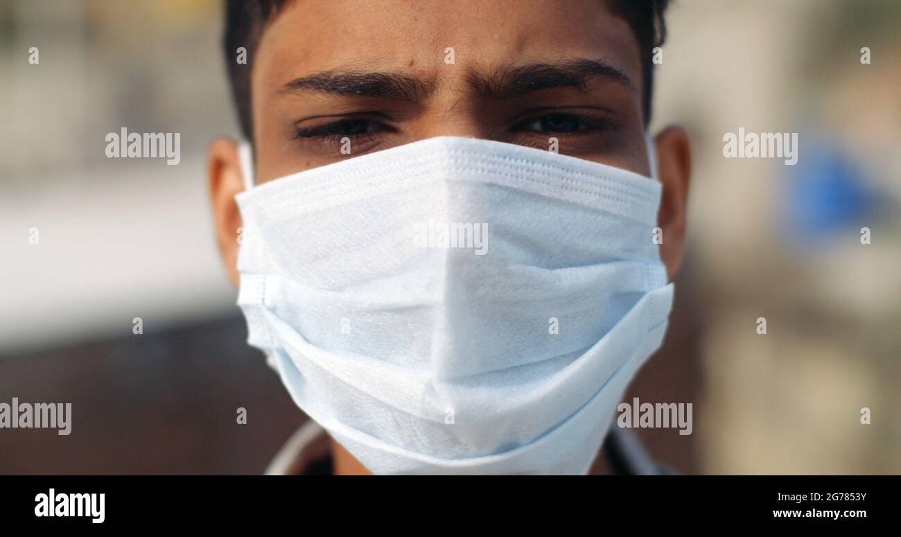 Closeup shot of an Indian boy wearing a mask- new normal concept Stock ...