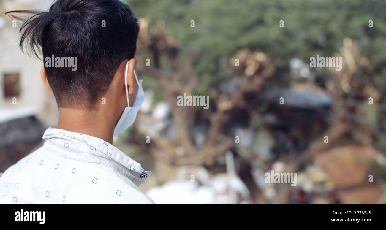 Closeup shot of an Indian boy wearing a mask- new normal concept Stock ...