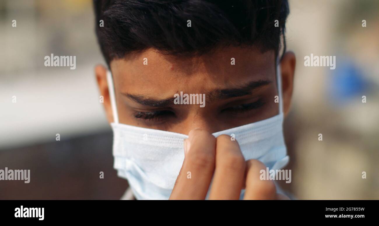 Closeup shot of an Indian boy wearing a mask- new normal concept Stock ...