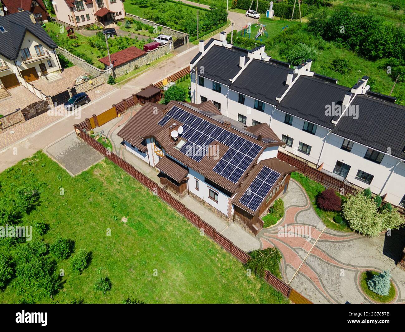 aerial view of house building with solar sun panels clean energy ...