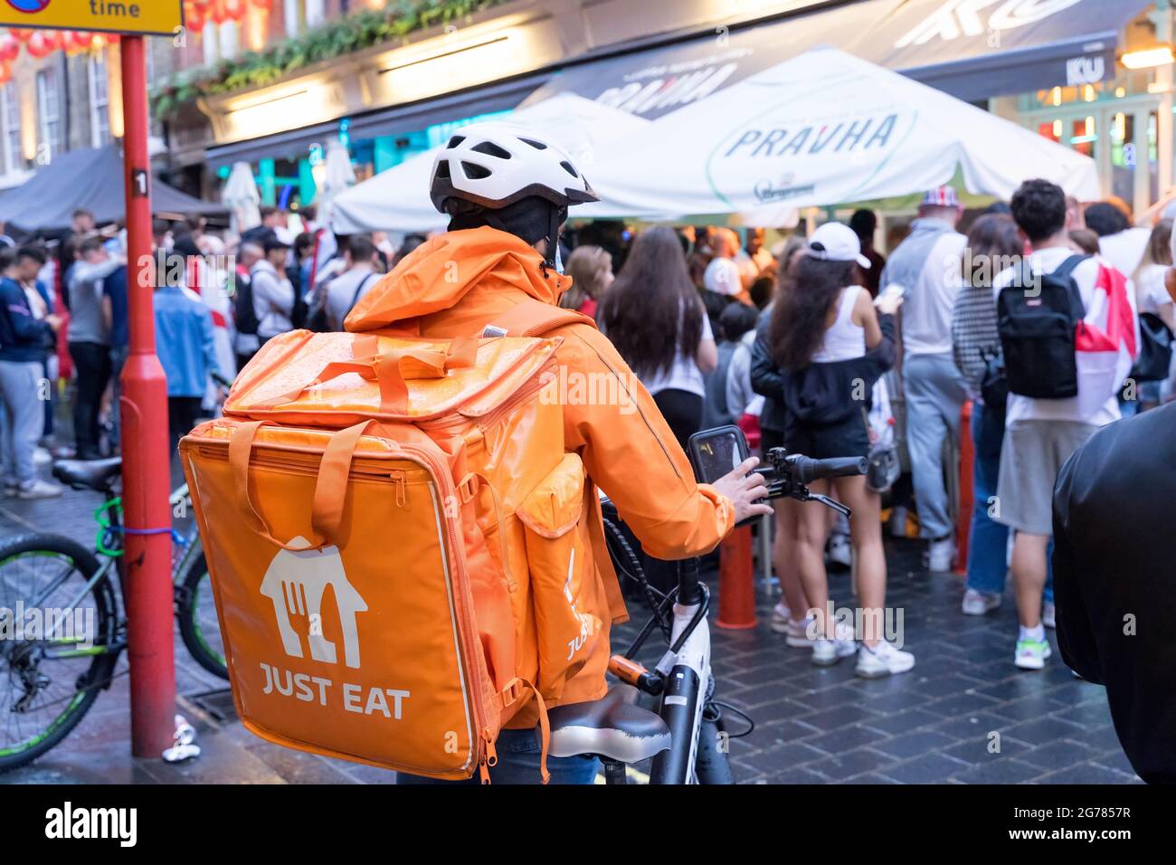 Just eat delivery rucksack in orange carried by cyclist in Central ...