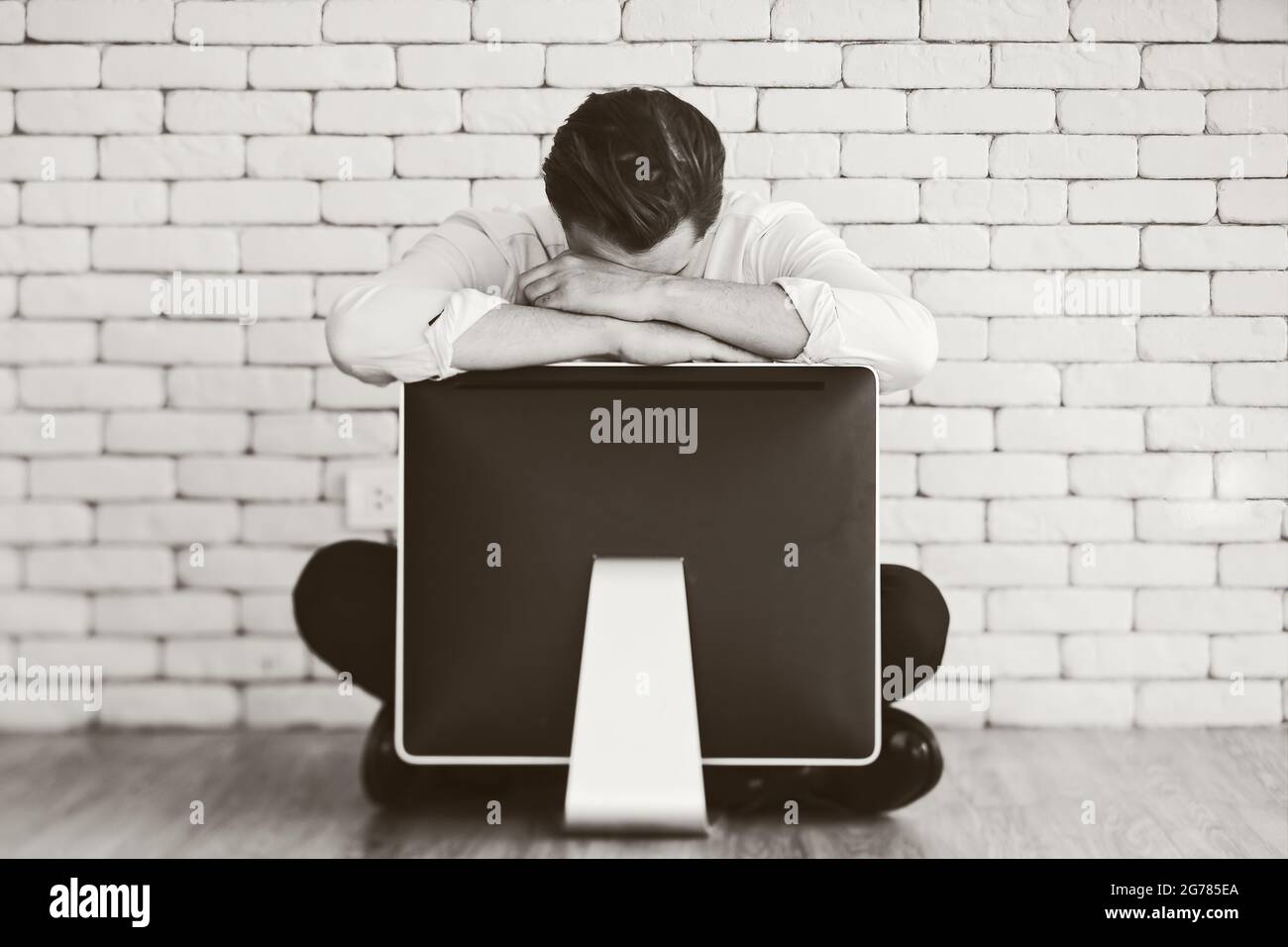 Businessman sitting and crying with hopeless on old and obsoleted model ...