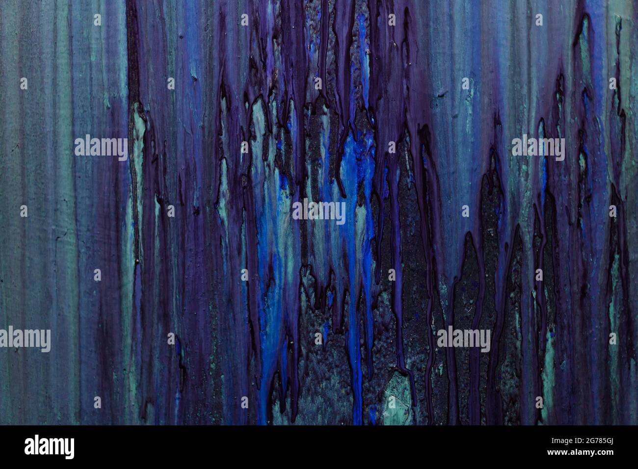 Neon paint drip on wall background Dark toned Stock Photo - Alamy