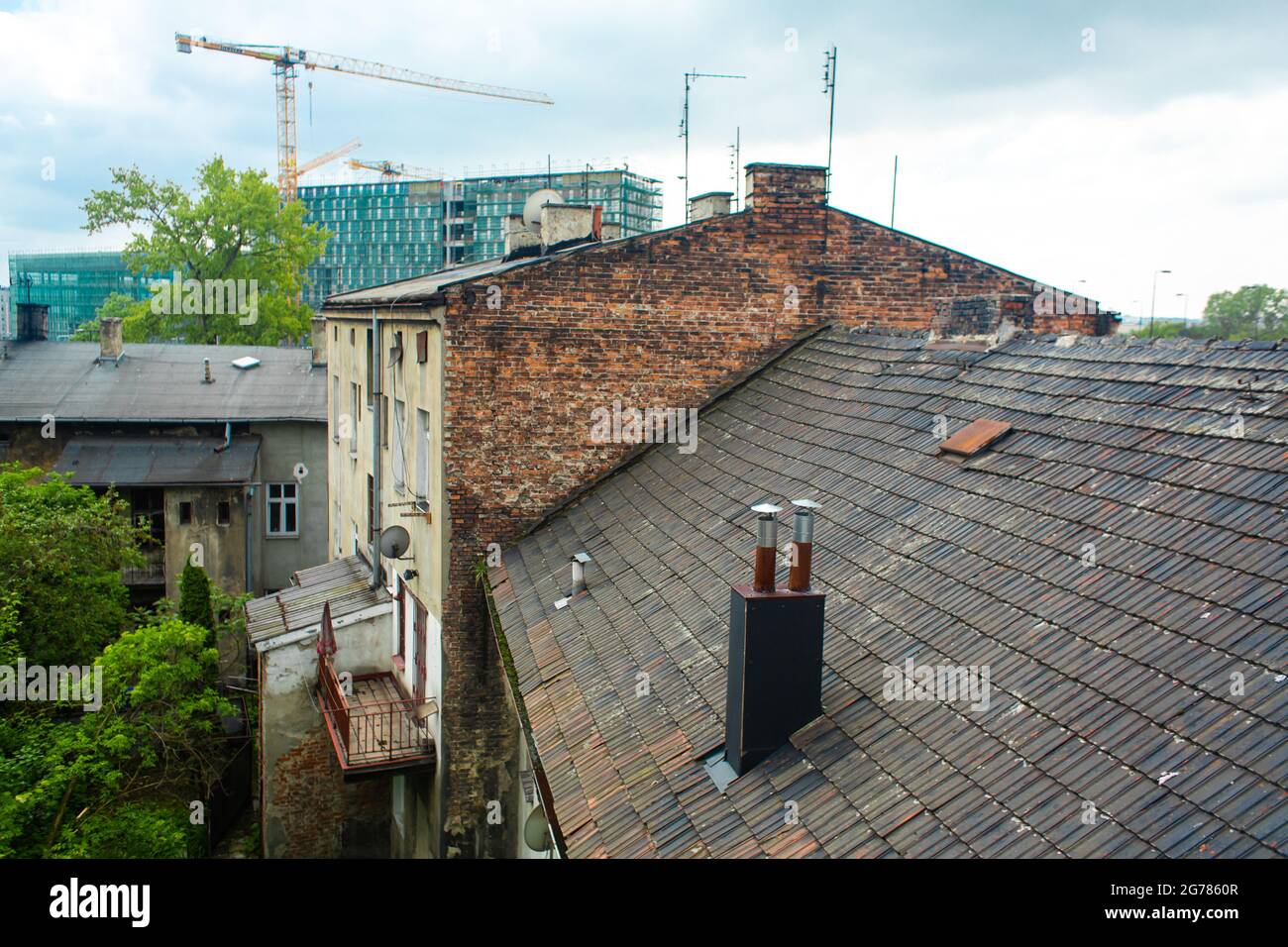 The roof of the old building is covered with tiles. The architecture of ...