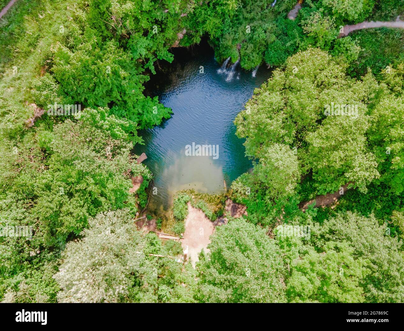 aerial view of beautiful waterfall with blue lake copy space Stock ...