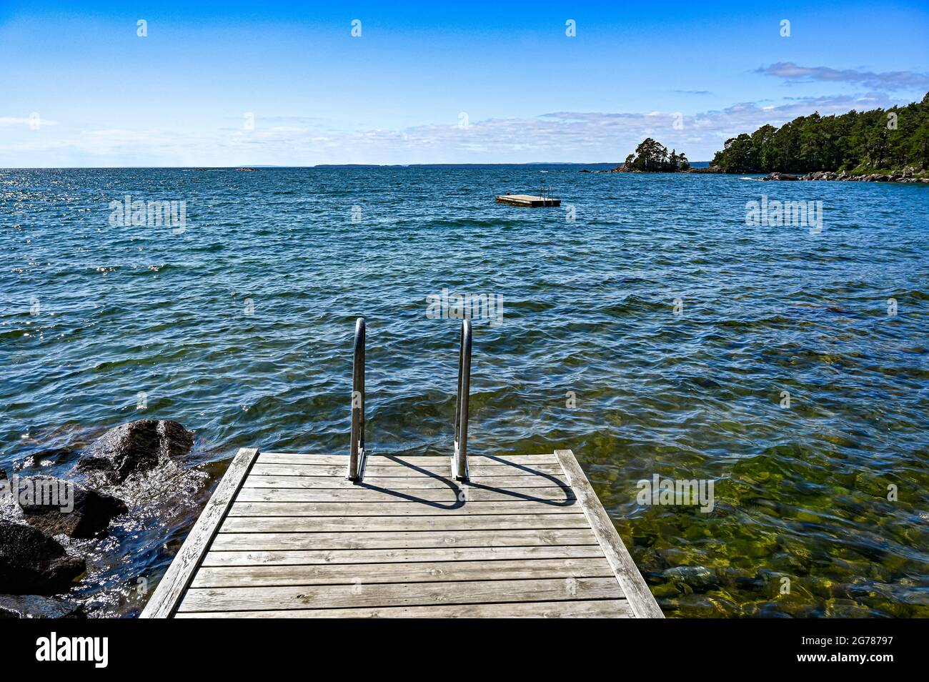 jetty with bathing ladder in lake Vattern Sweden Stock Photo - Alamy