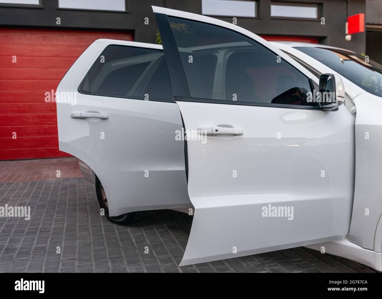 Side view of new white modern car with open doors. Luxury expensive car ...
