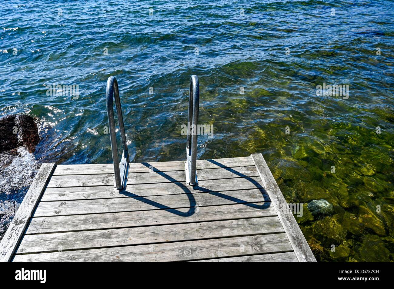 jetty with bathing ladder in lake Vattern Sweden Stock Photo - Alamy