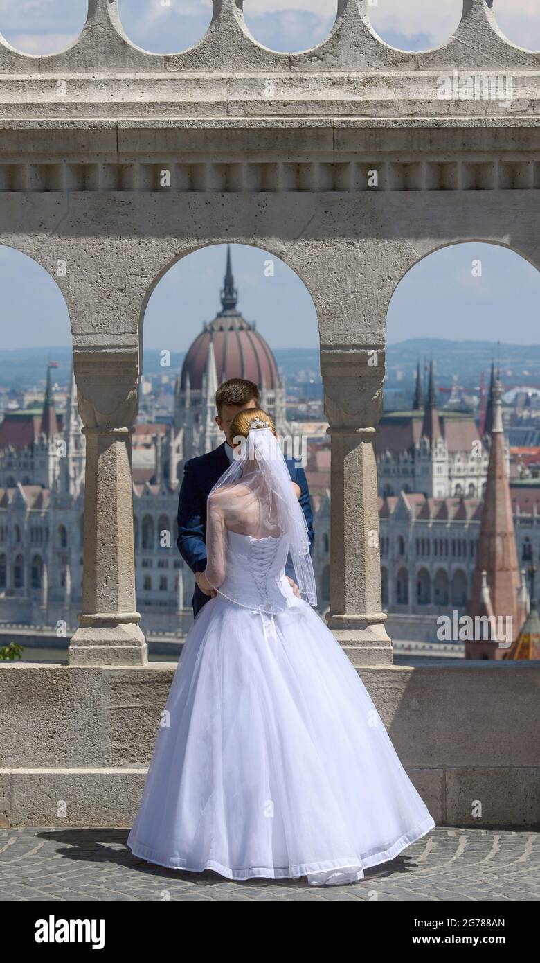 Budapest, Hungary. 26th June, 2021. A wedding couple stands by the ...