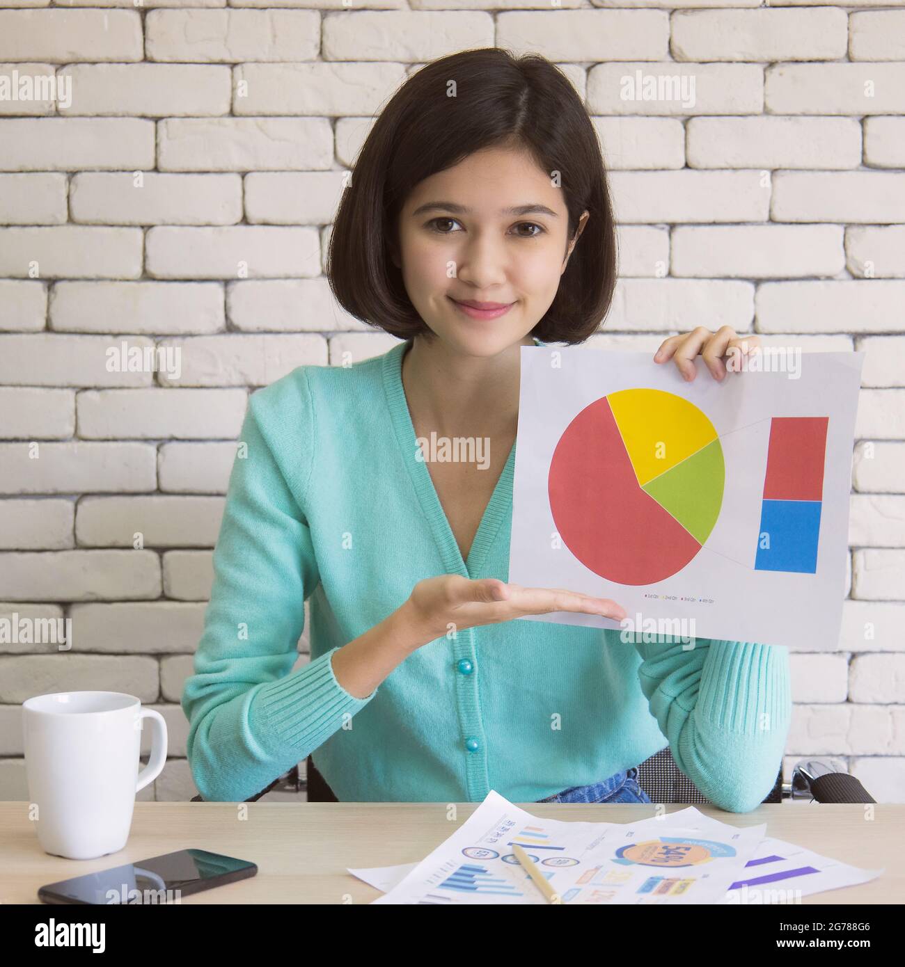 Half race Thai-German short hair cute girl holding paper of business ...