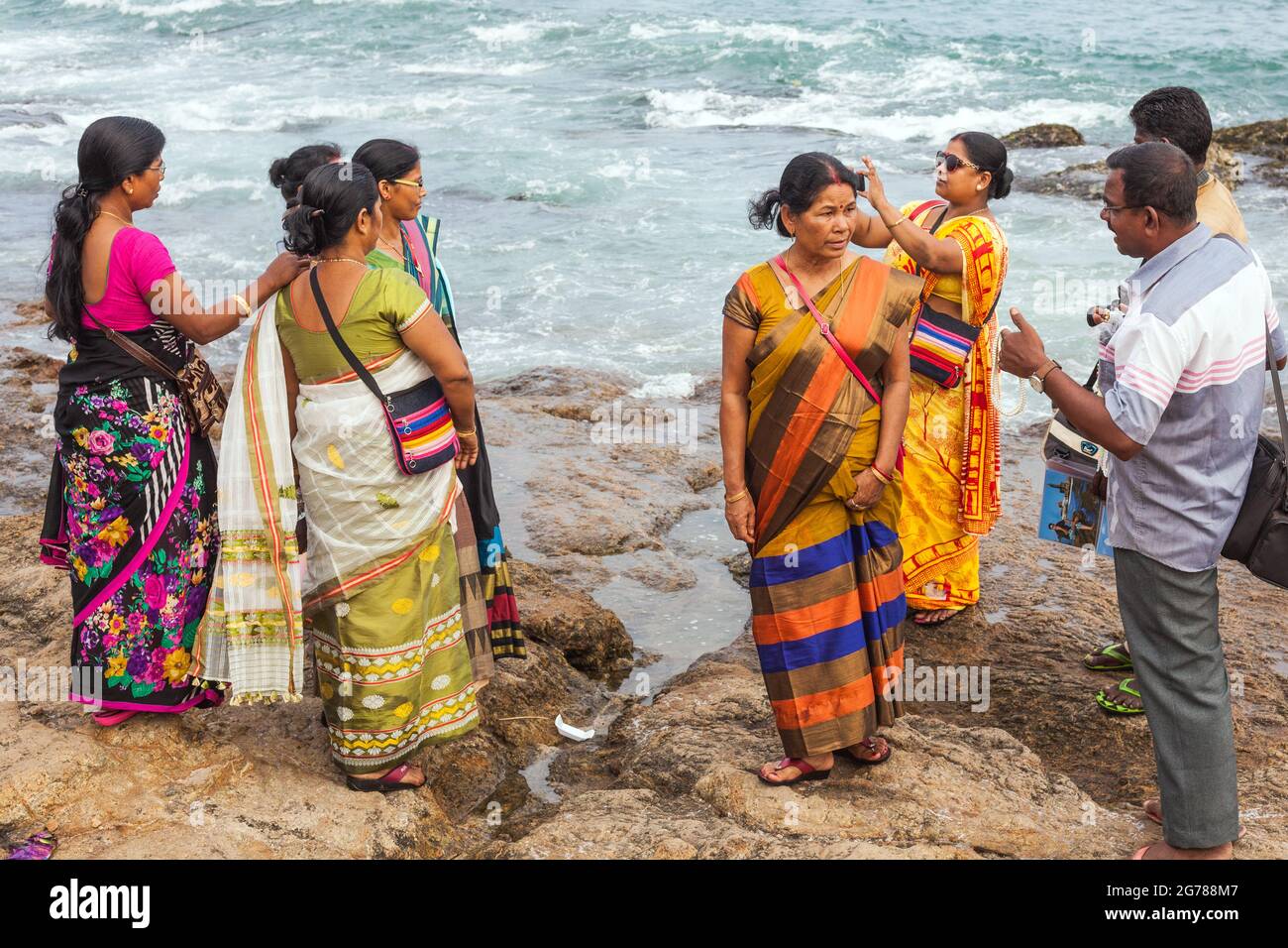 Group of Indian ladies elegantly dressed in saris pose for photo on ...