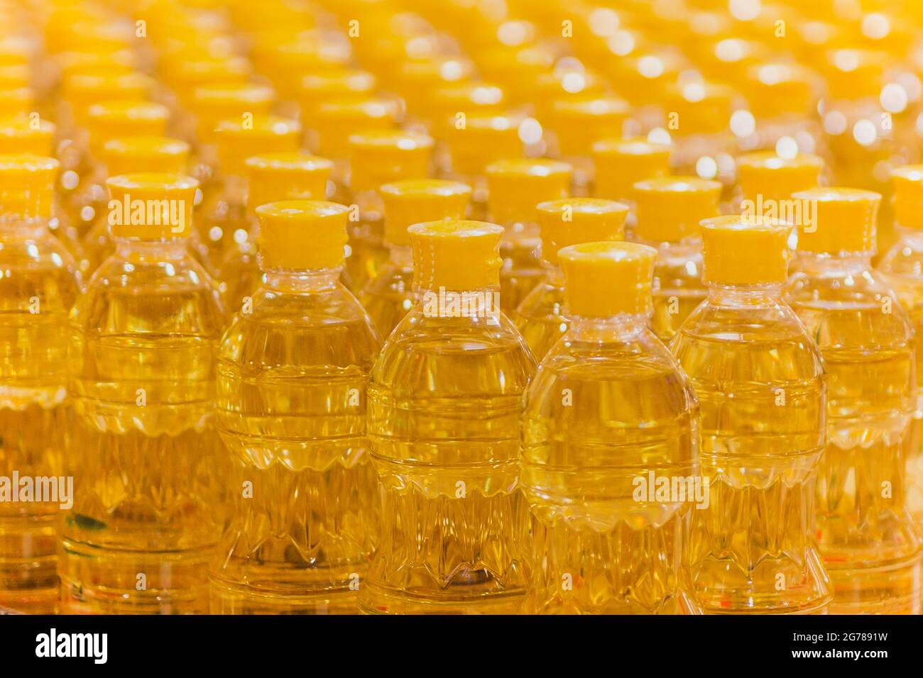 Plastic bottles of cooking oil in a row themed background Stock Photo ...
