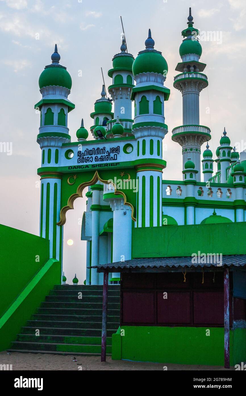 Close up of the green minarets of Darga Sherief mosque at sunrise ...