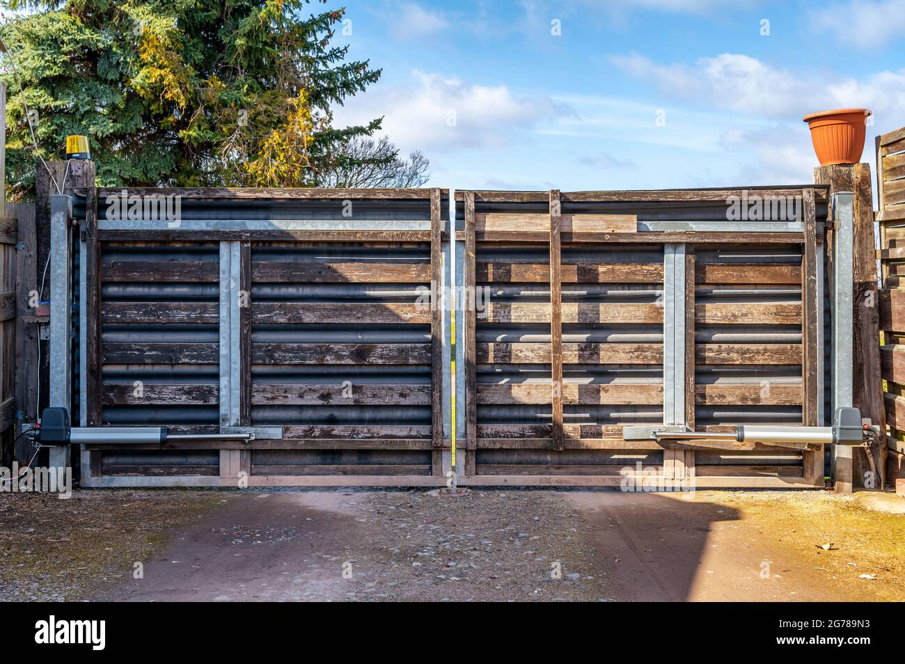 Wide gate with gate operator for automatic opening of the gate of a ...