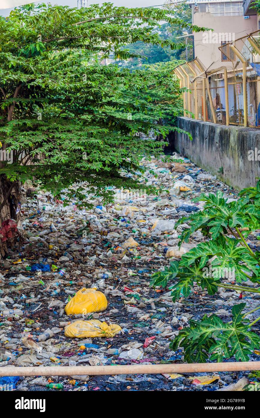 Dumping ground of discarded waste, garbage, rubbish littering area ...