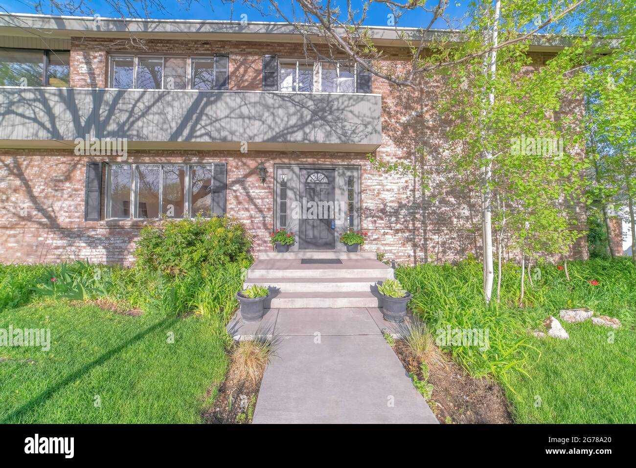 Front view of two storey house on real estate listing with lockbox on ...