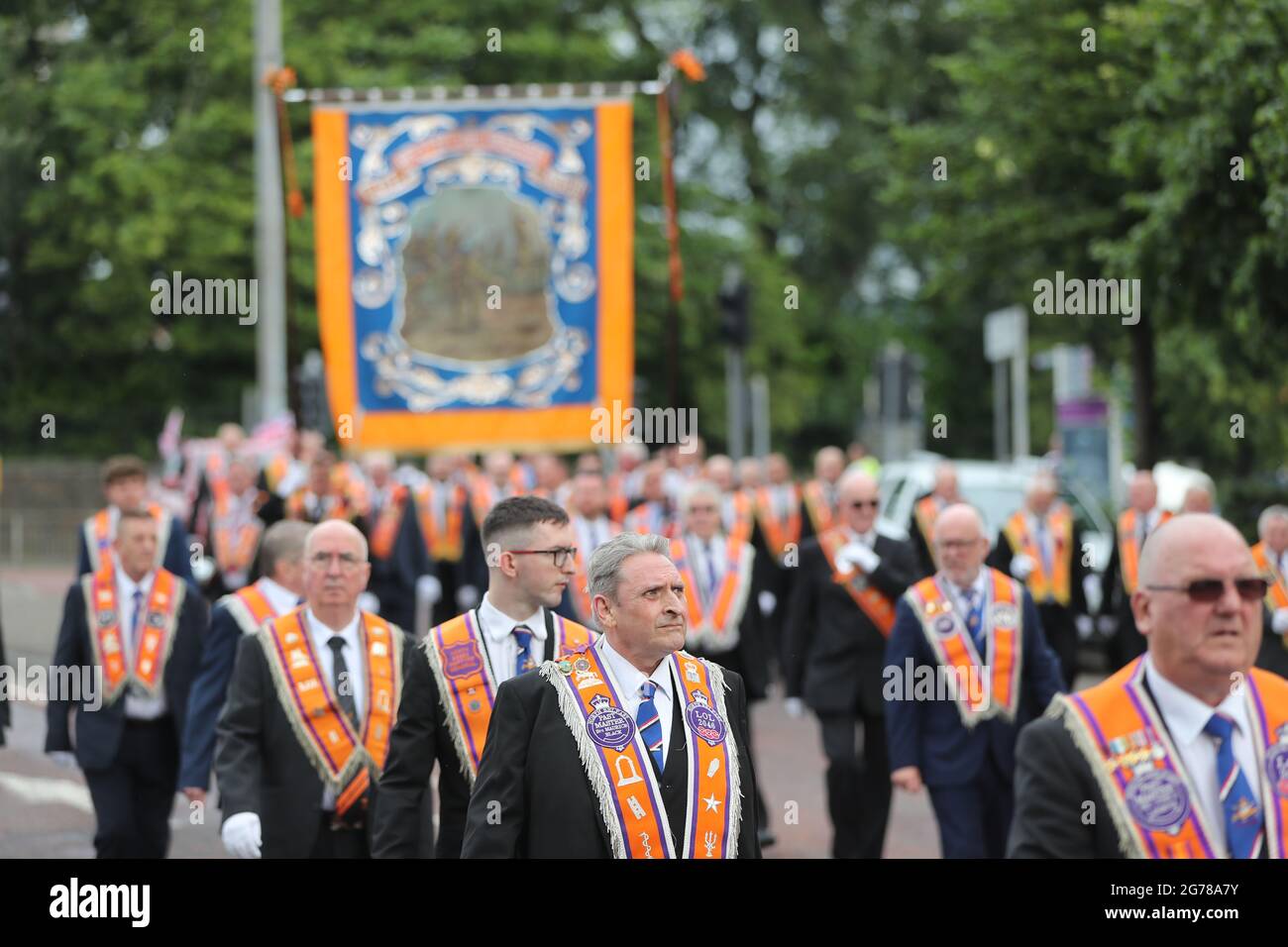 Orangemen march in the Clifton Street area of Belfast as part of the ...