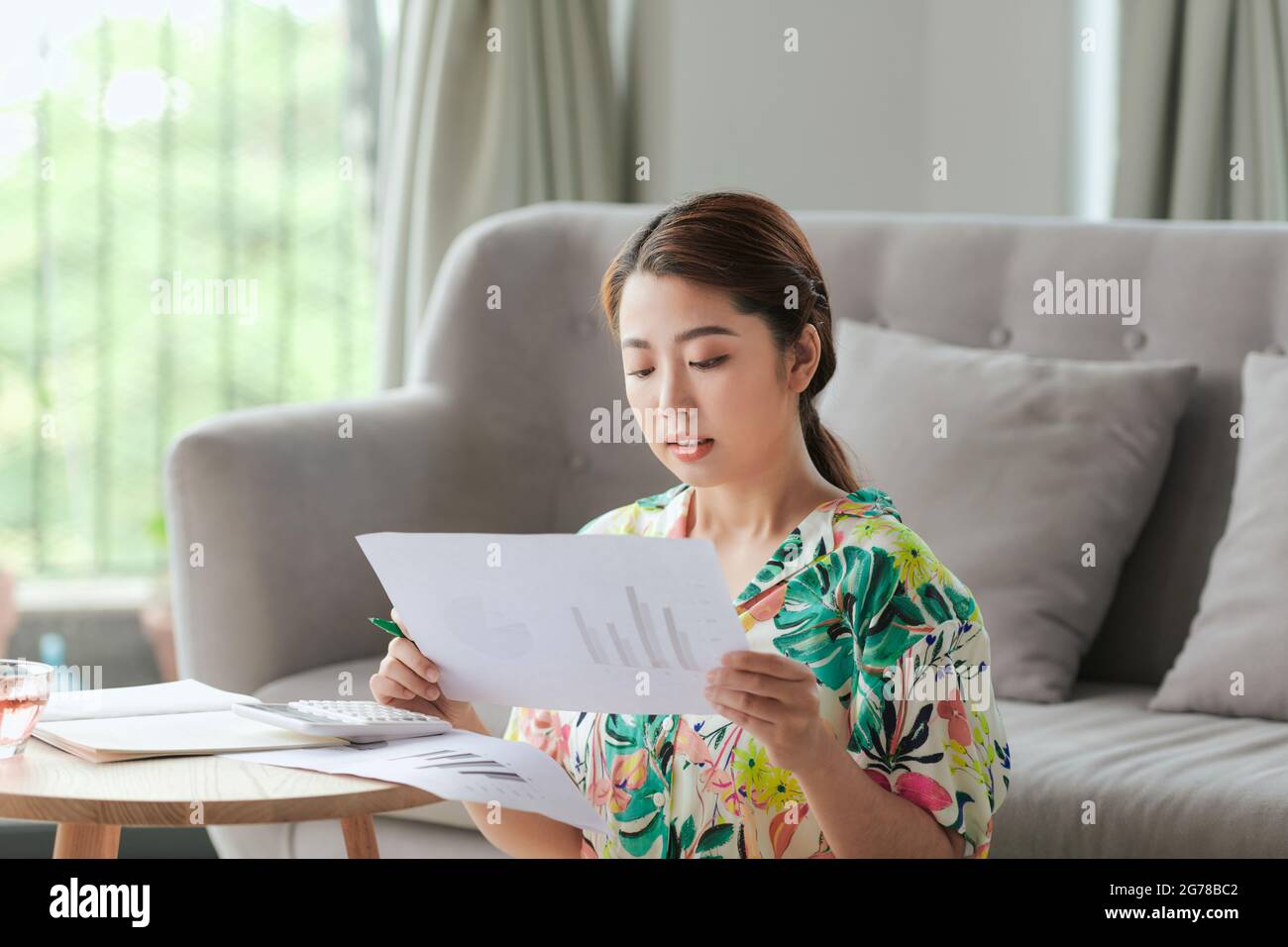 Chinese girl doing homework table hi-res stock photography and images ...