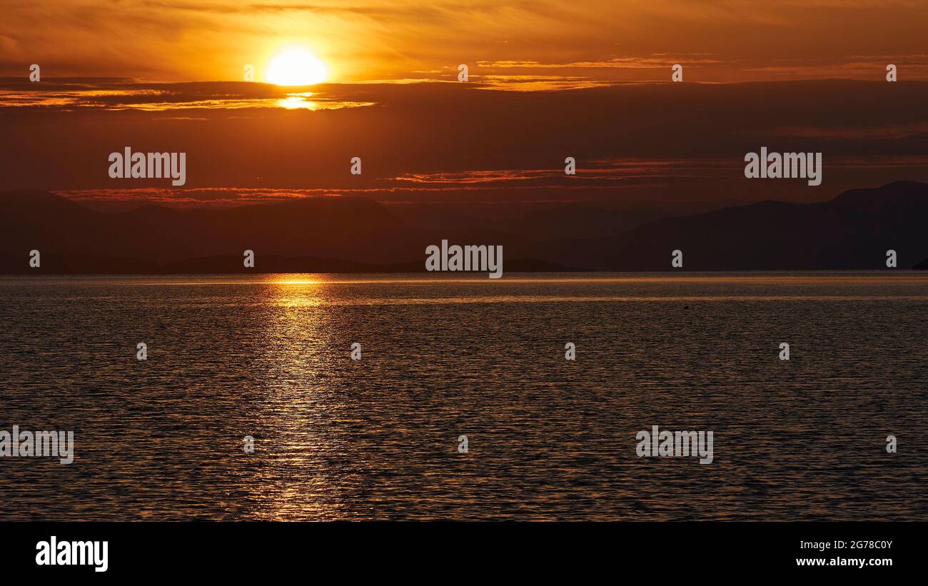 Sun rises over the mainland hi-res stock photography and images - Alamy