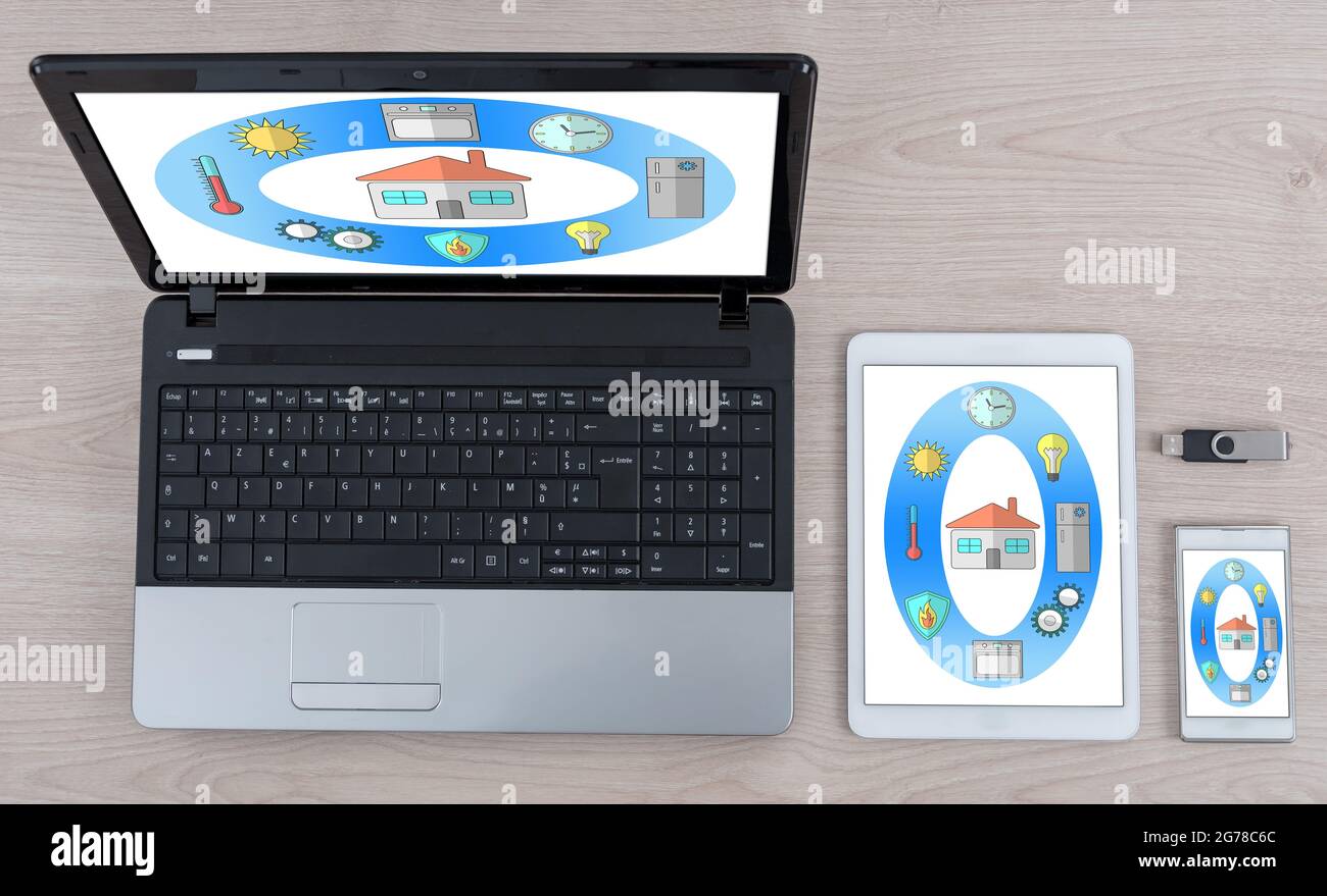 Smart home concept shown on different information technology devices ...
