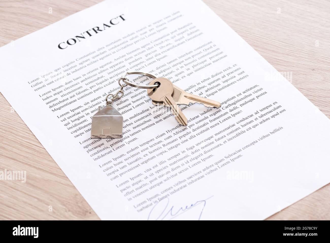 House keys on a signed contract Stock Photo - Alamy