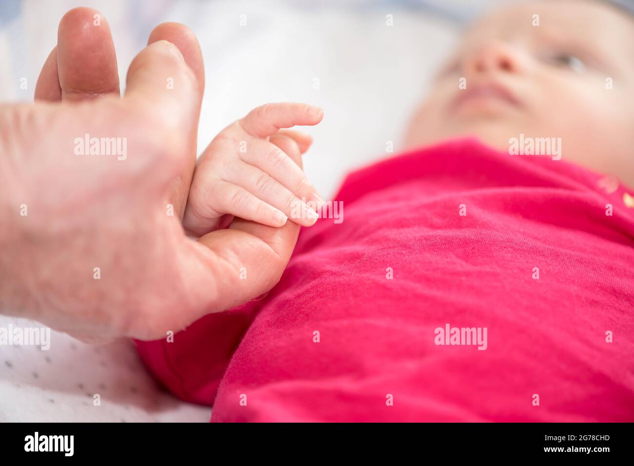 Father hand holding tiny baby hand Stock Photo - Alamy