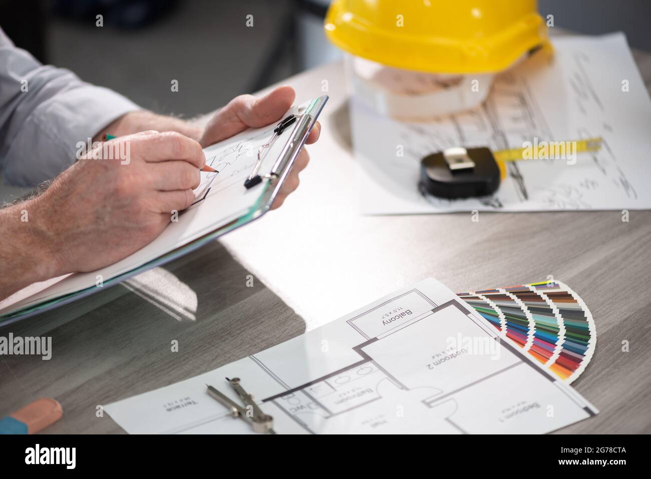 Architect working on a project in office Stock Photo - Alamy