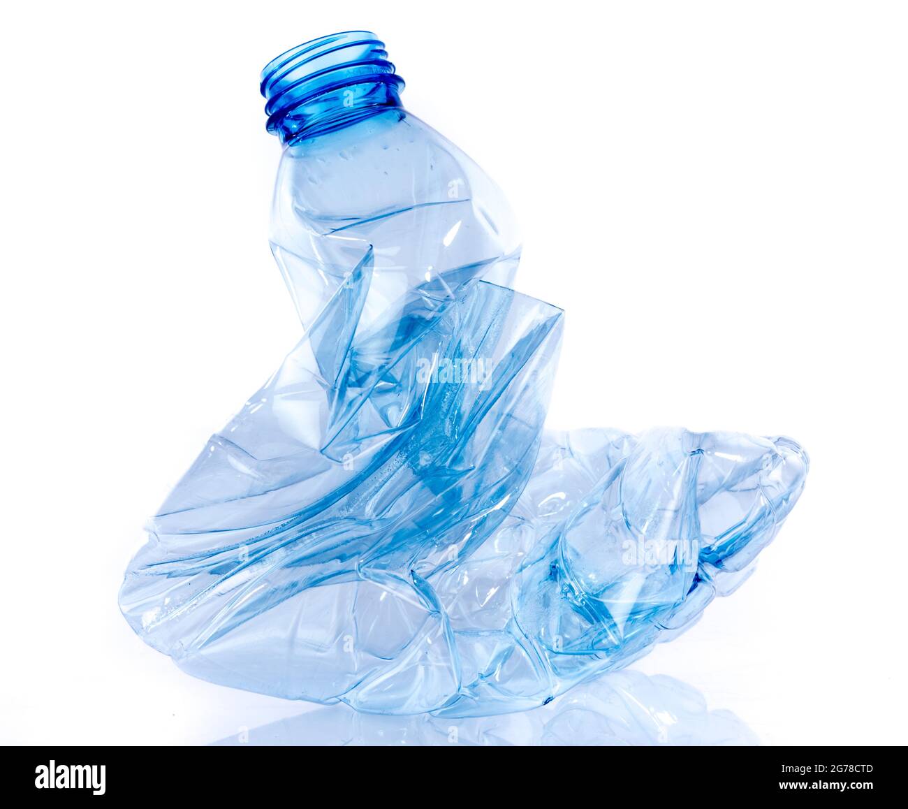 Crushed plastic bottle, isolated on white Stock Photo - Alamy