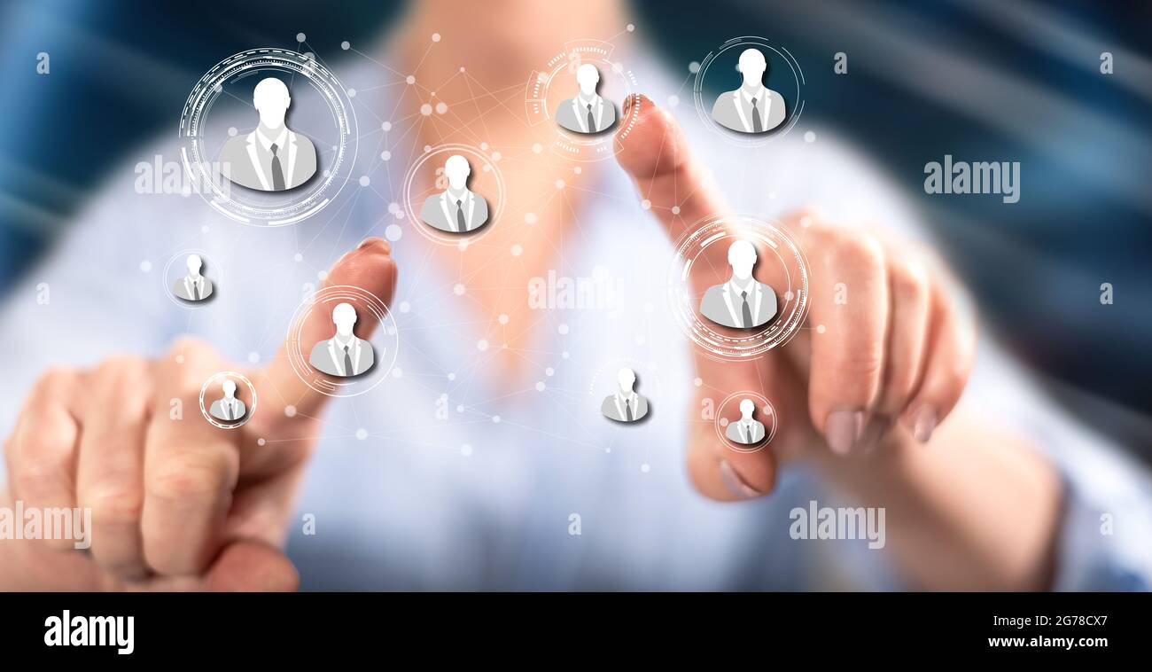 Woman touching a cooperation concept on a touch screen with her fingers ...