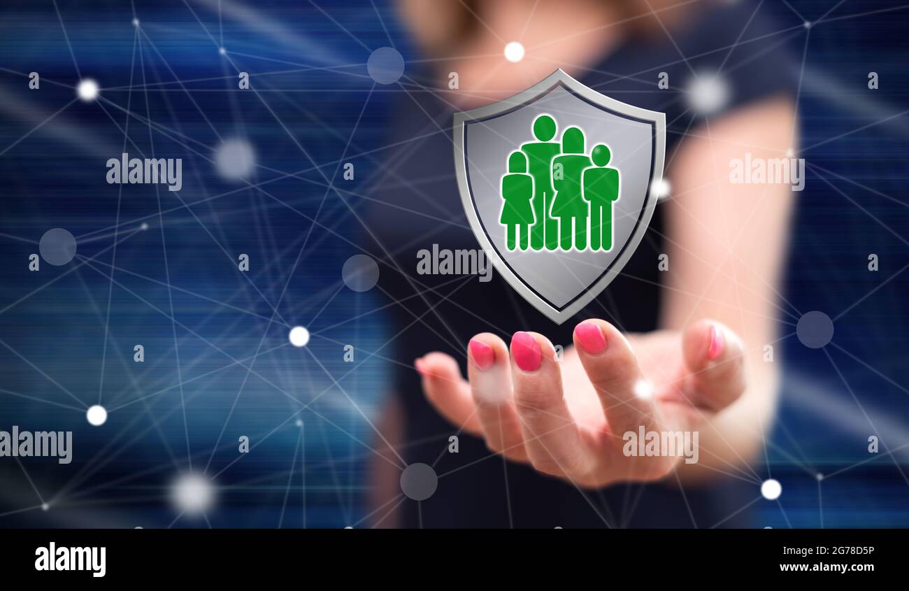Family protection concept above the hand of a woman in background Stock ...