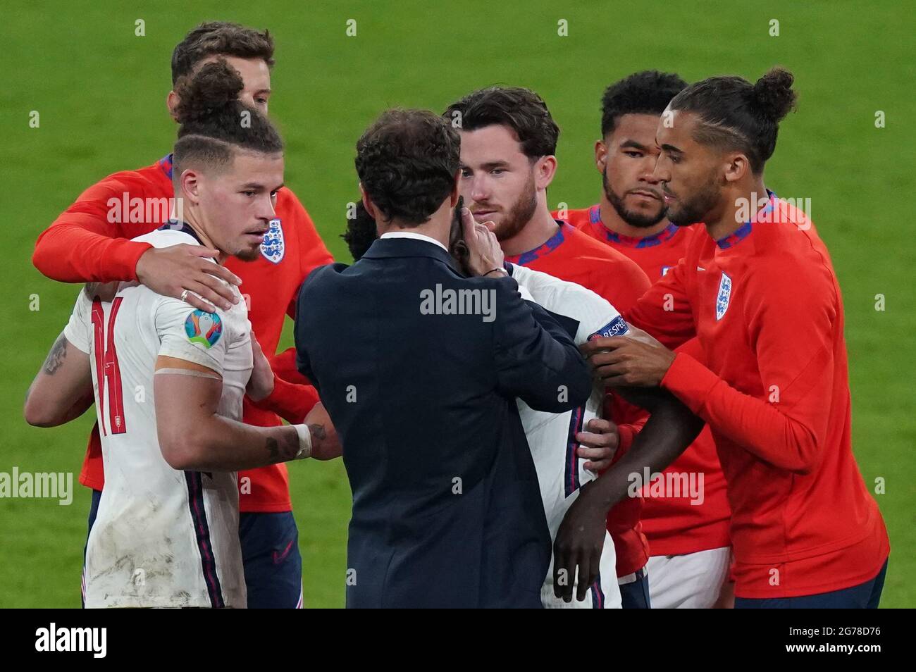 England's Bukayo Saka is consoled by manager Gareth Southgate after ...