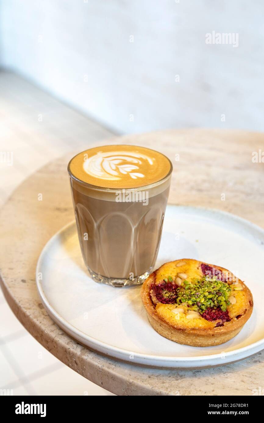 Latte and raspberry pine nut frangipane tart at WatchHouse coffee shop ...