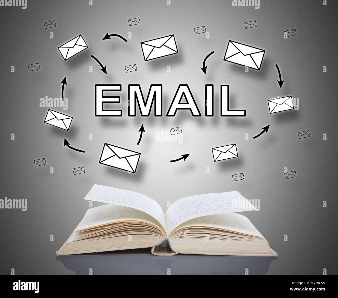 Email concept above an open book Stock Photo - Alamy