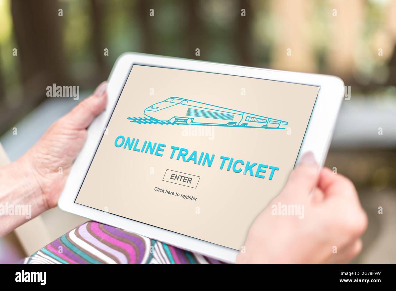 Female hands holding a tablet with online train ticket concept Stock ...