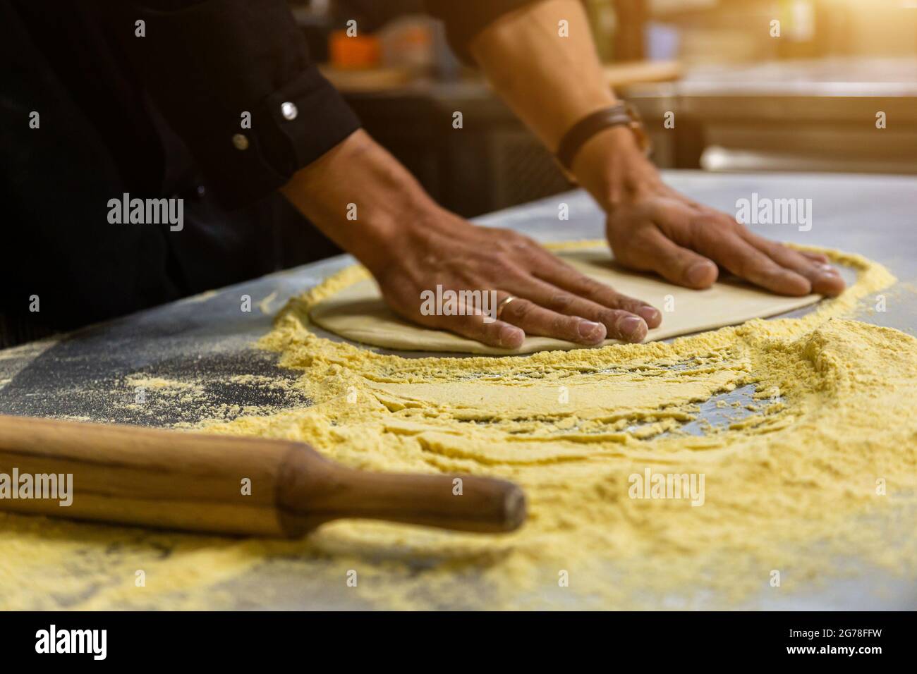 Professional chef cooking in the kitchen restaurant at the hotel ...