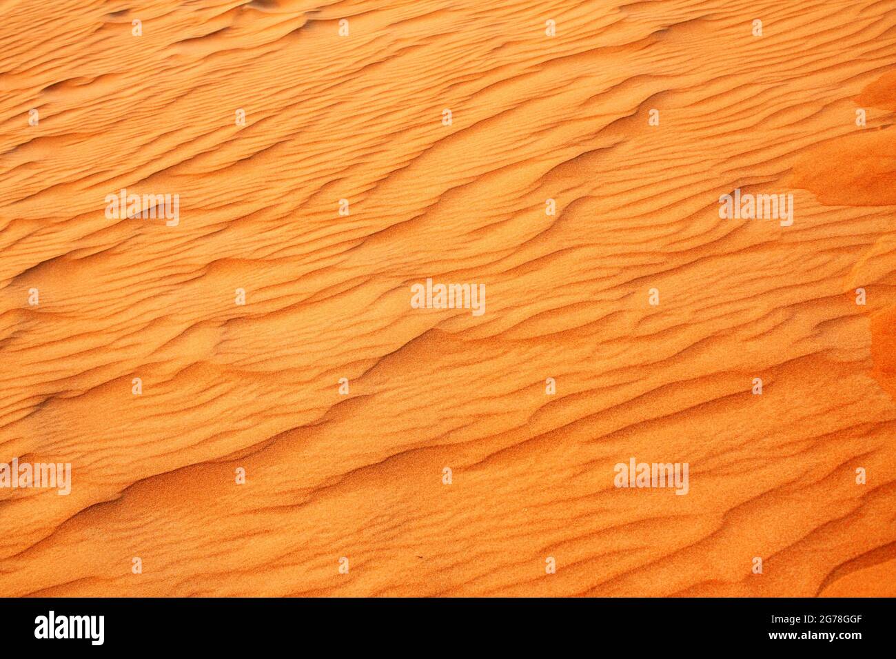 Sand of orange color in desert, UAE. Desert rippled sand texture Stock ...