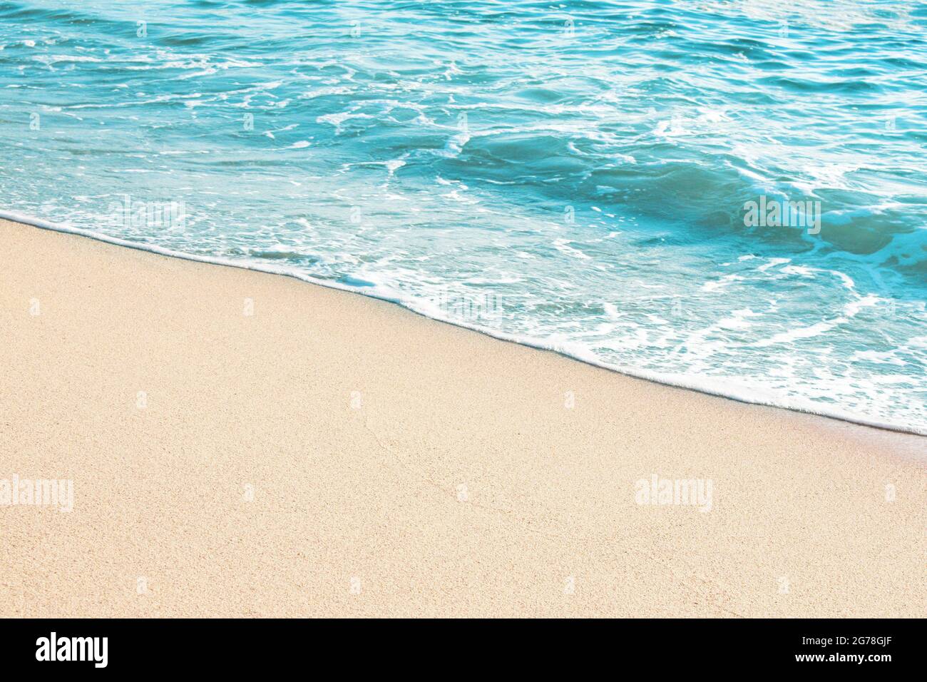 Soft blue ocean wave on sandy beach. Mockup template. Copy space for ...