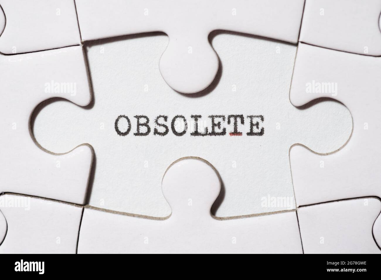 Obsolete word written with a typewriter Stock Photo - Alamy