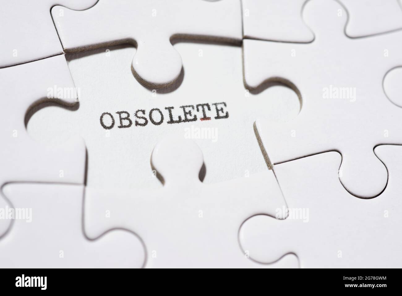 Obsolete word written with a typewriter Stock Photo - Alamy