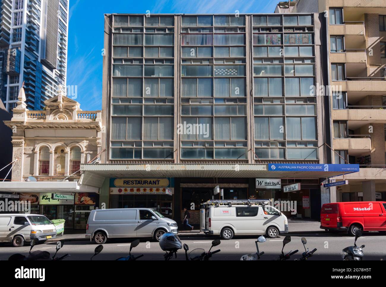 Sitting between a Victorian era shop and office above building and a ...