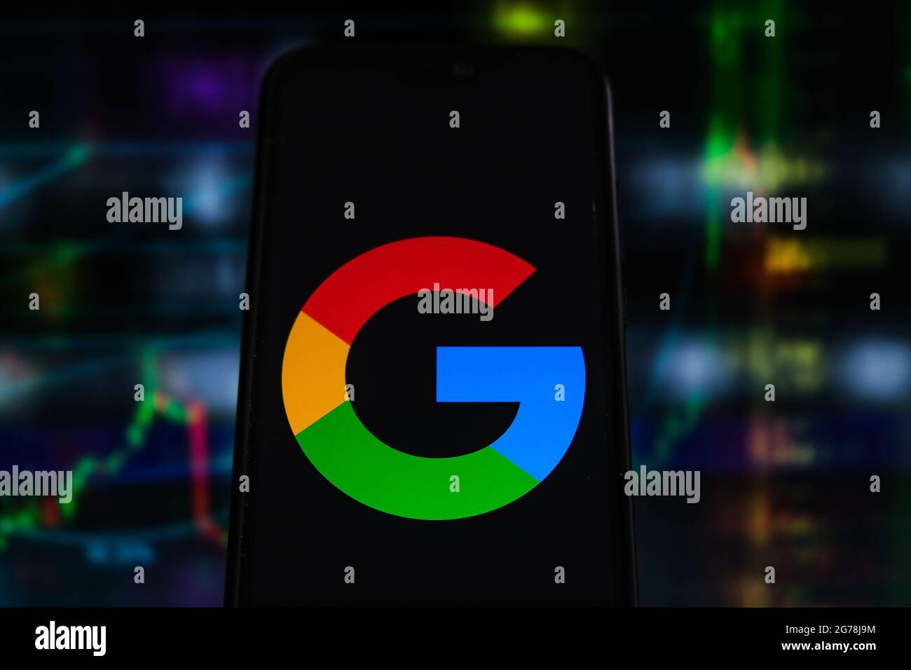 In this photo illustration a Google logo seen displayed on a smartphone ...