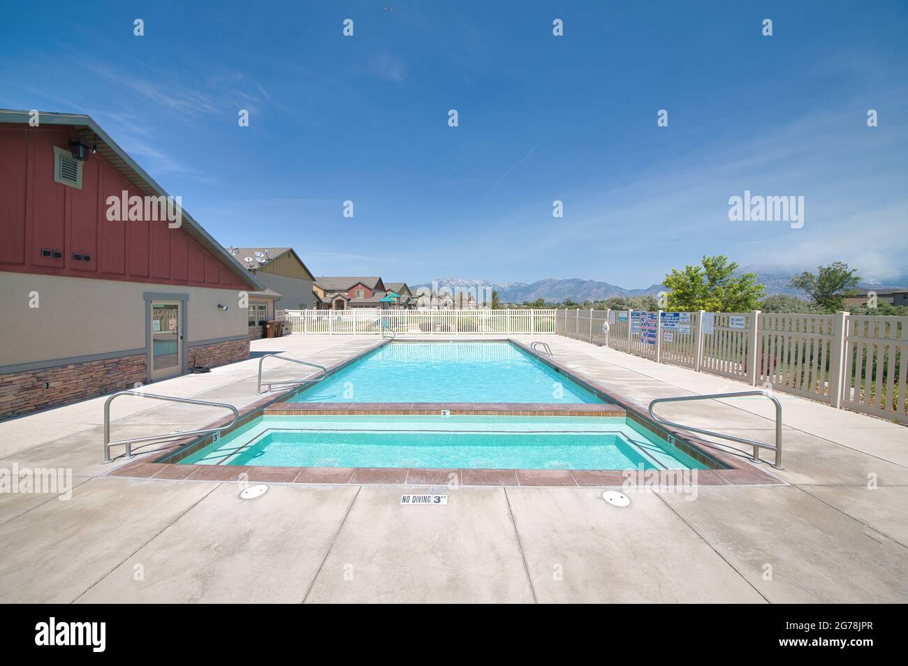 Shallow and full size pool for adults and kids with mountain and sky ...