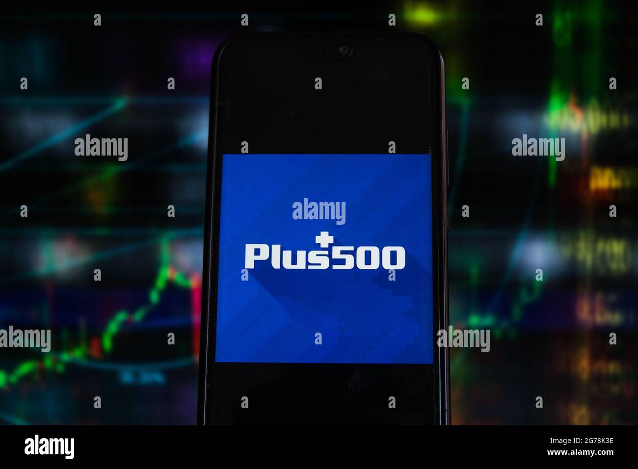 In this photo illustration a Plus500 logo seen displayed on a ...
