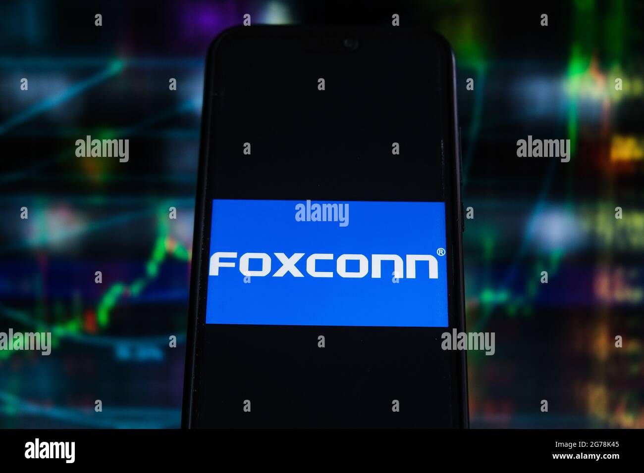 In this photo illustration a Foxconn logo seen displayed on a ...